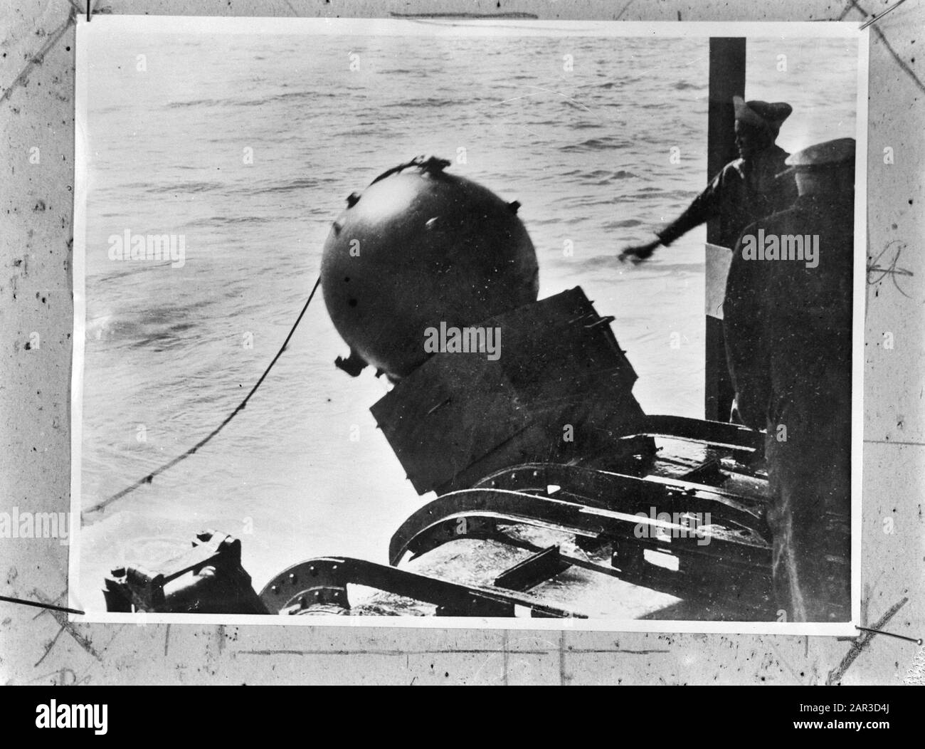 A Dutch minelaying lays mines in the waters of the Dutch East Indies ...