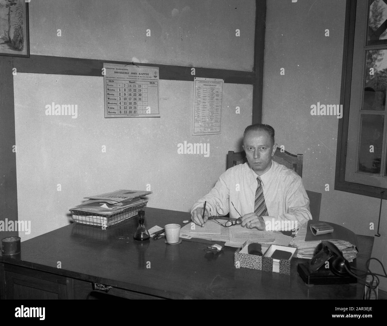Man behind desk desk Black and White Stock Photos & Images - Alamy