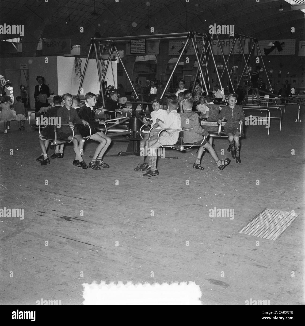 Family on carousel in amusement Black and White Stock Photos & Images ...