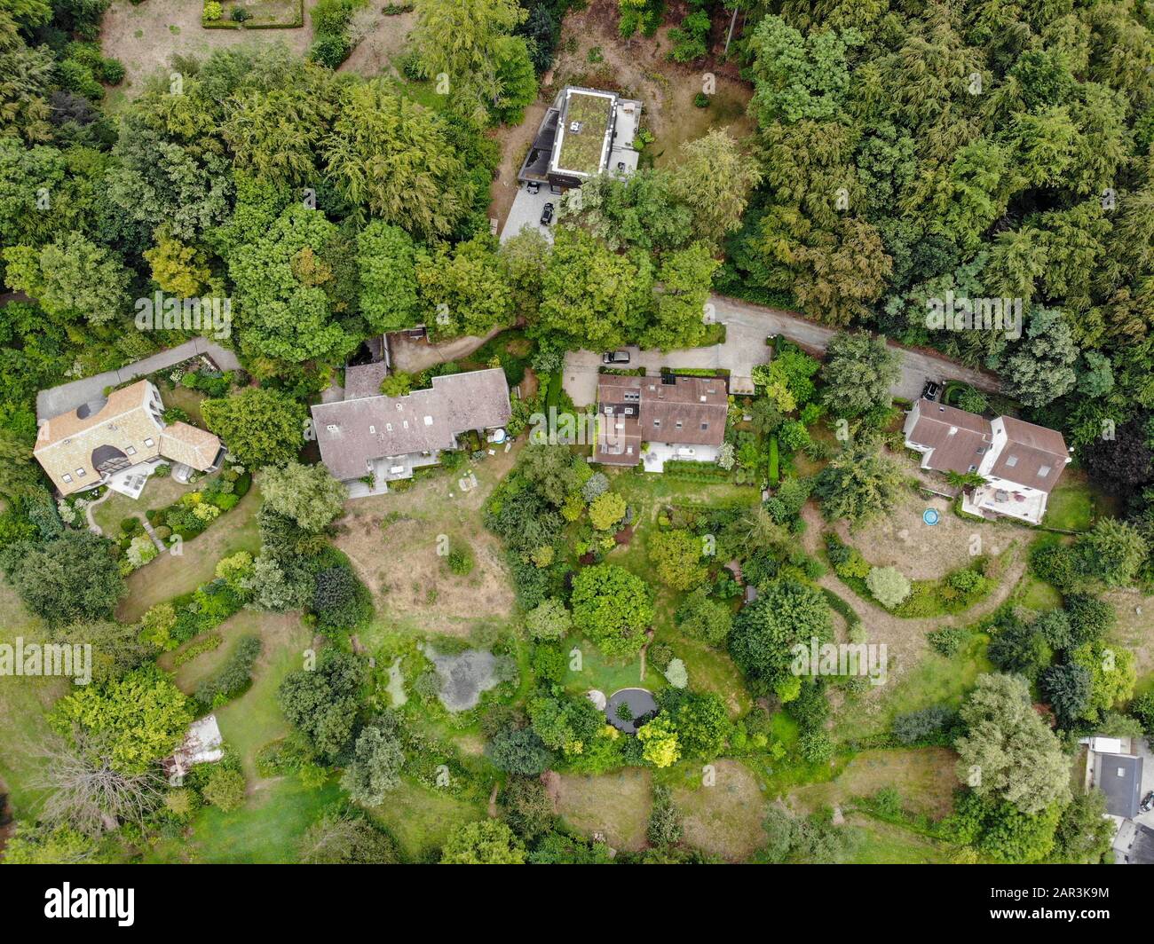 Aerial view of country side area with villas and garden surrounded by ...