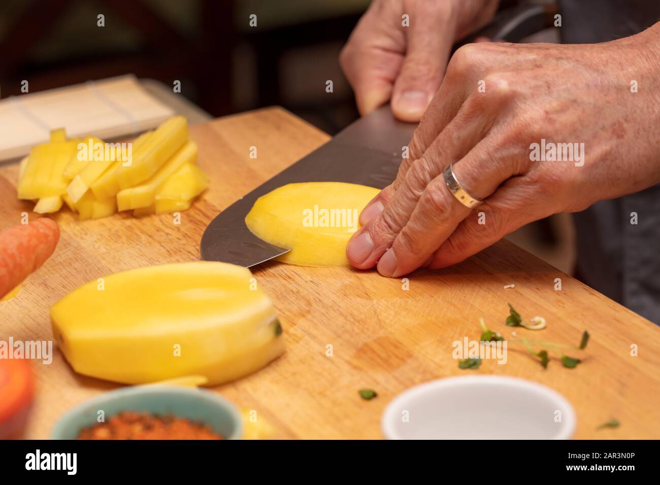 Chef teaching how to cut fruit julienne style for a sushi class Stock ...