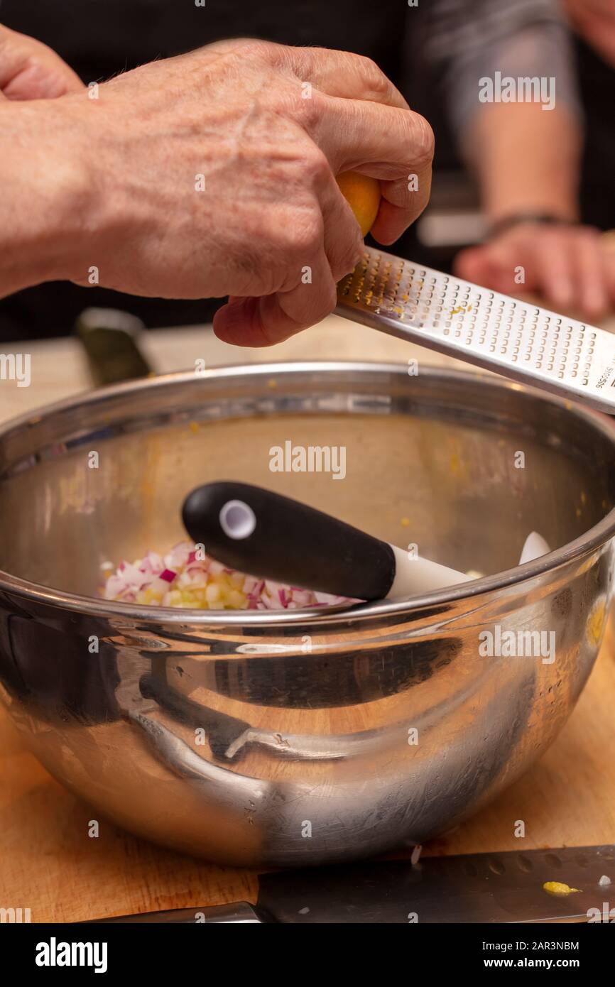 The process of making sushi and slicing during a chef's demonstration ...