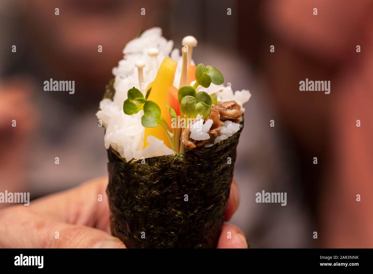 Chef's demonstration on how to make Shushi Cone rolls with rice ...
