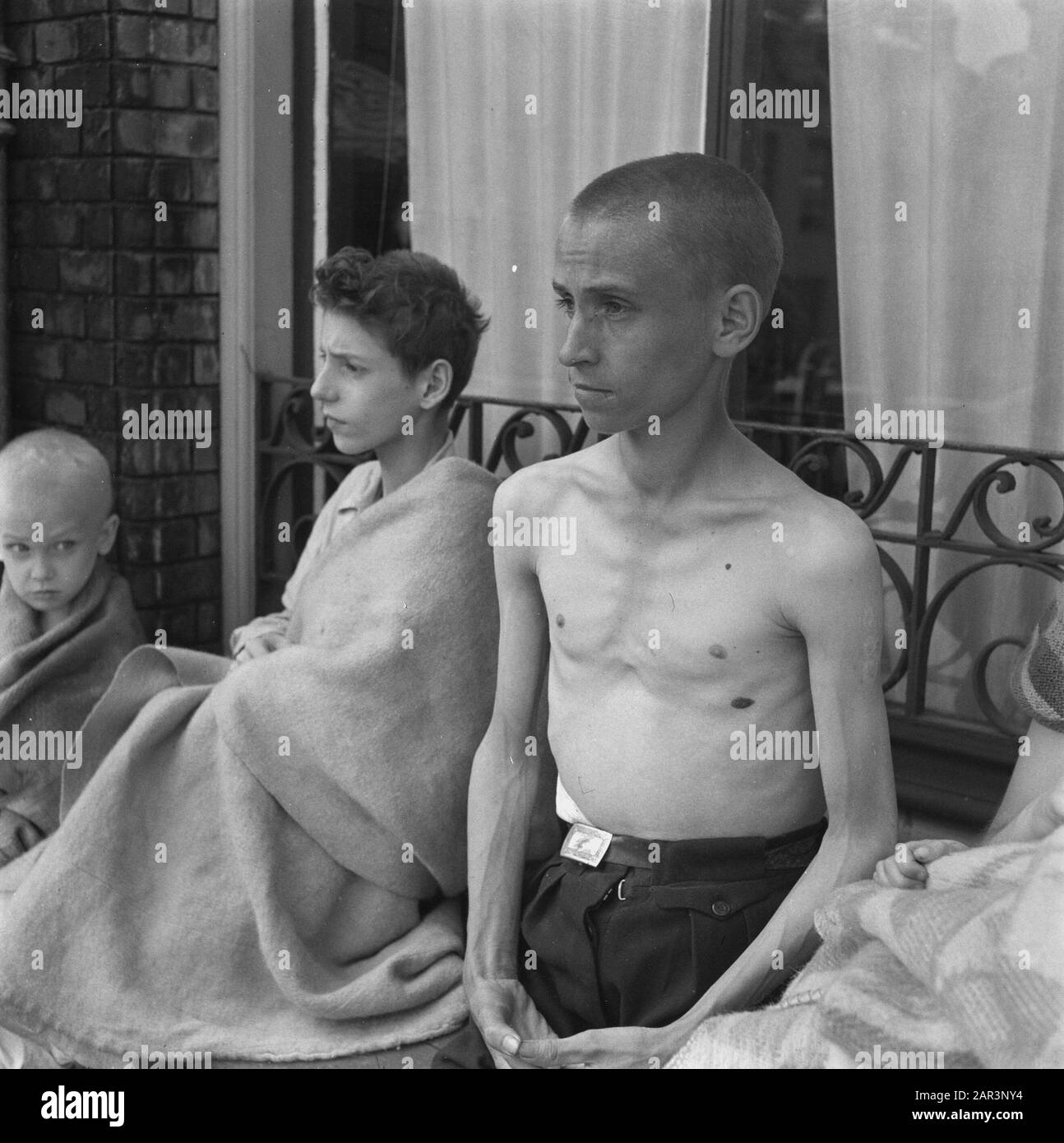 Child care of the Red Cross Malnourished children wrapped in blankets ...