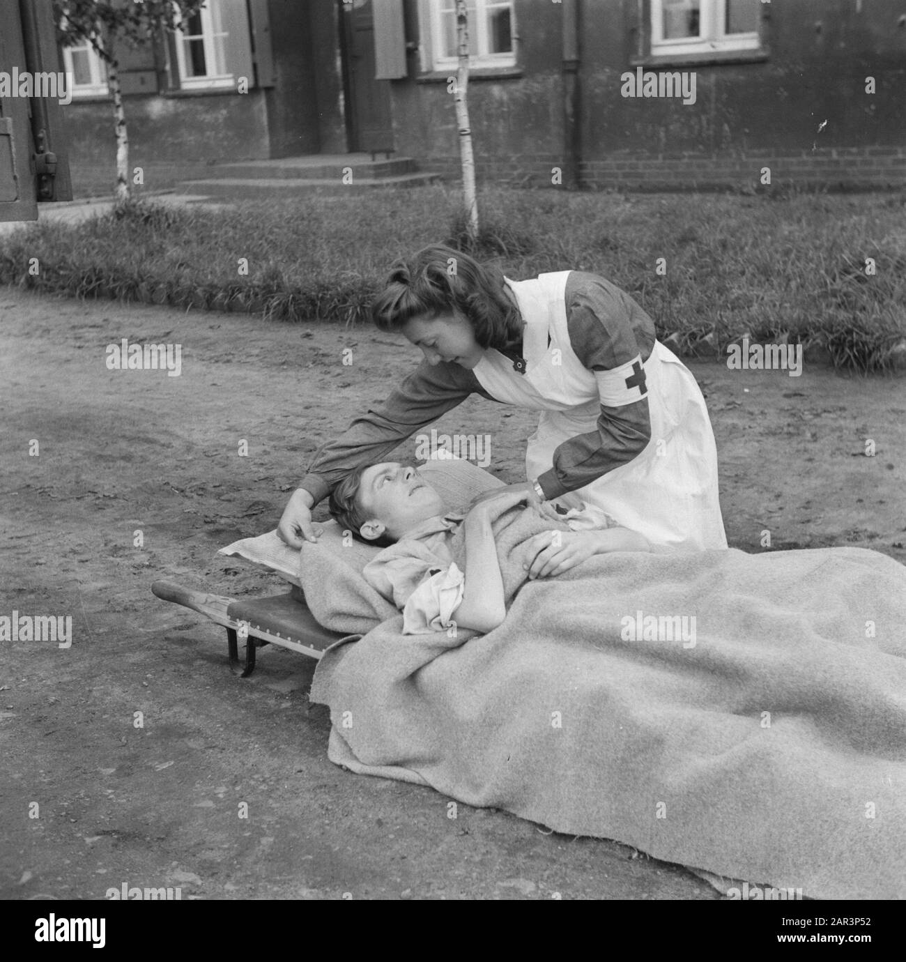 Repatriation Camp Rheine (Germany) [A sick on a stretcher with a nurse ...