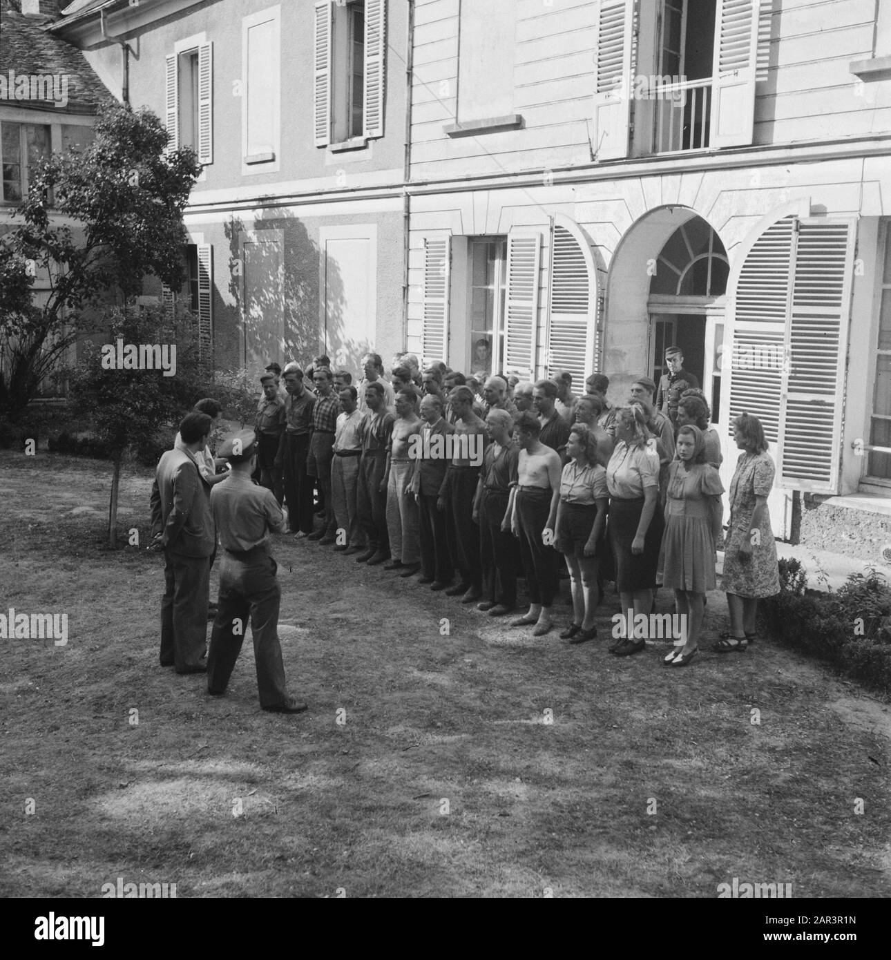 Land traitors in France A group of men, and some women, standing in ...
