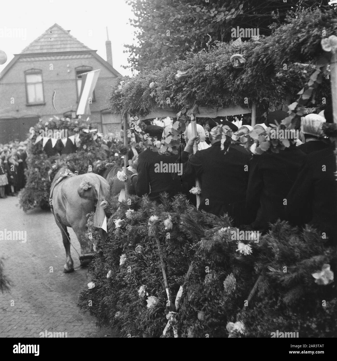 Boerenfeest in a Drenthe village With bushhei decorated carts driving ...