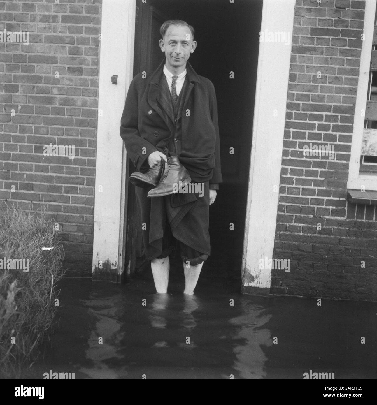 Repair man front door Black and White Stock Photos & Images - Alamy