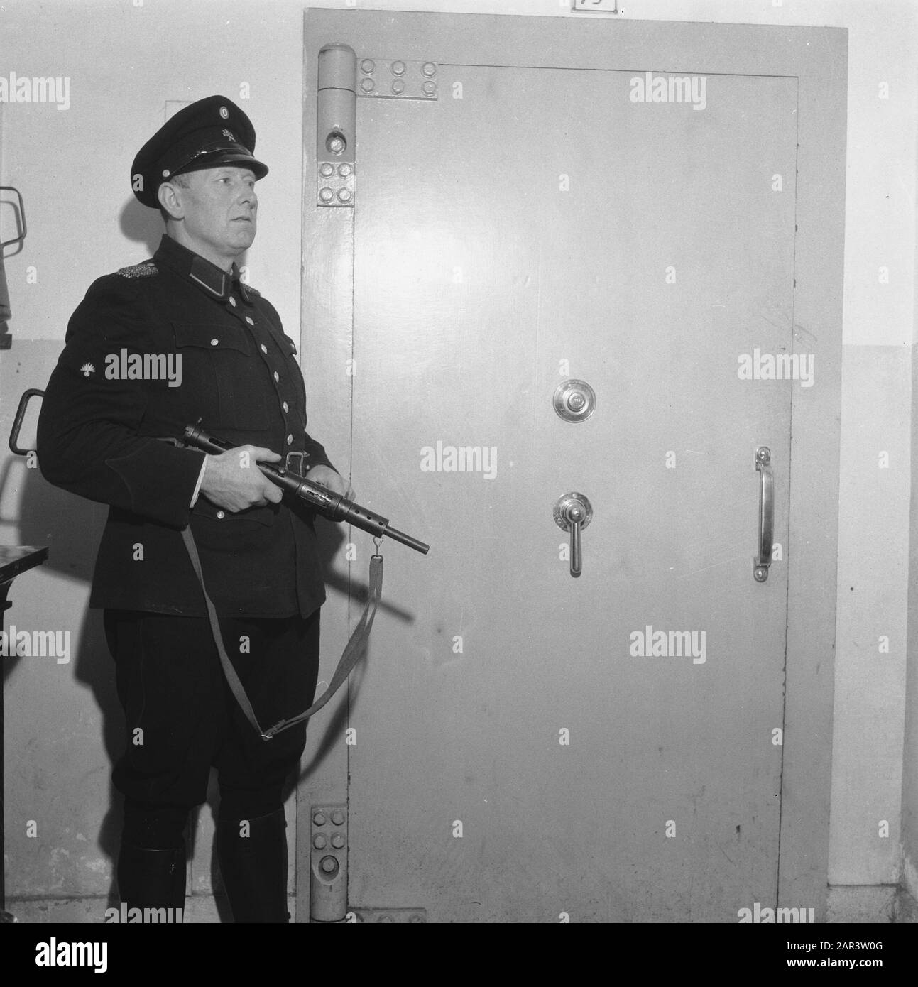 Money Purification Police officer with stengun for safe door Date: 1945 ...
