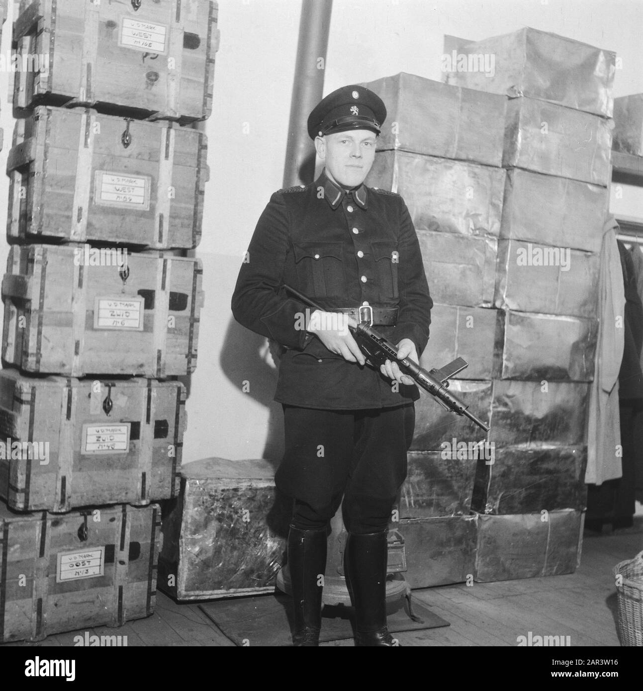 Money Purge Police officer with stengun for several chests Date: 1945 ...