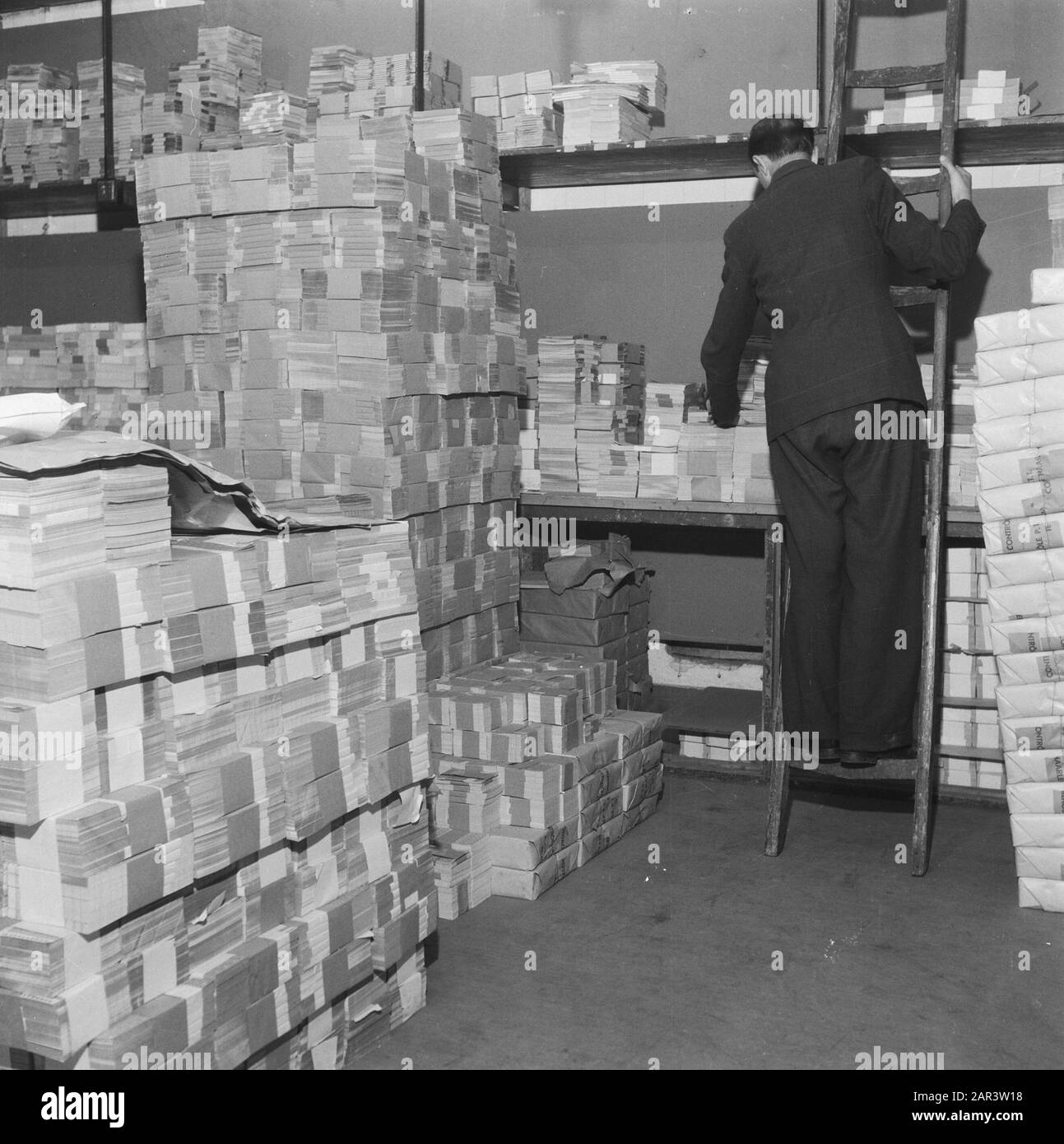 Money Purge Money Purge. Man stands on ladder in a storage room with ...
