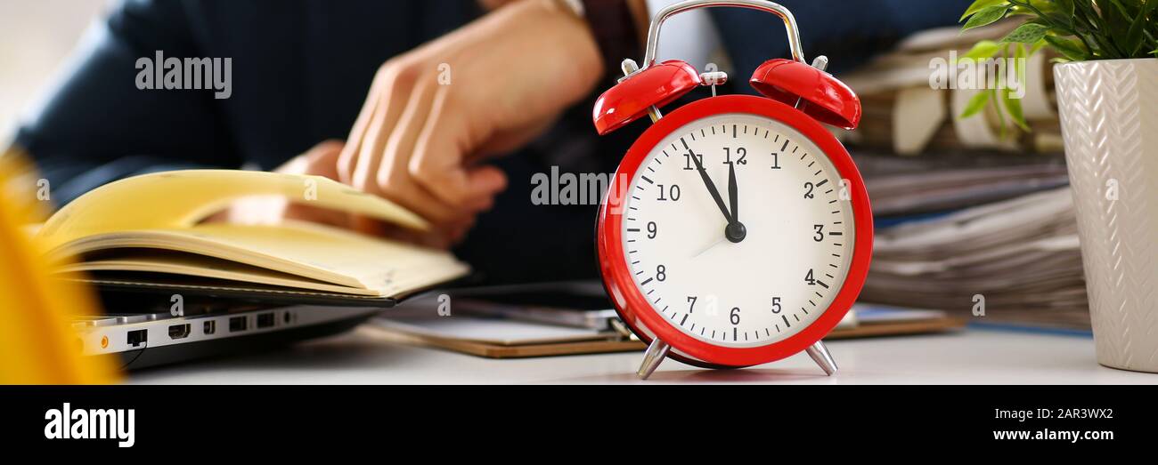 Businessman shows clock hi-res stock photography and images - Alamy