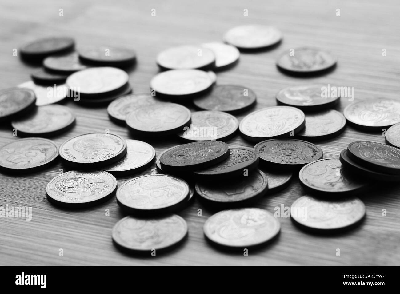 Coins scale Black and White Stock Photos & Images - Alamy
