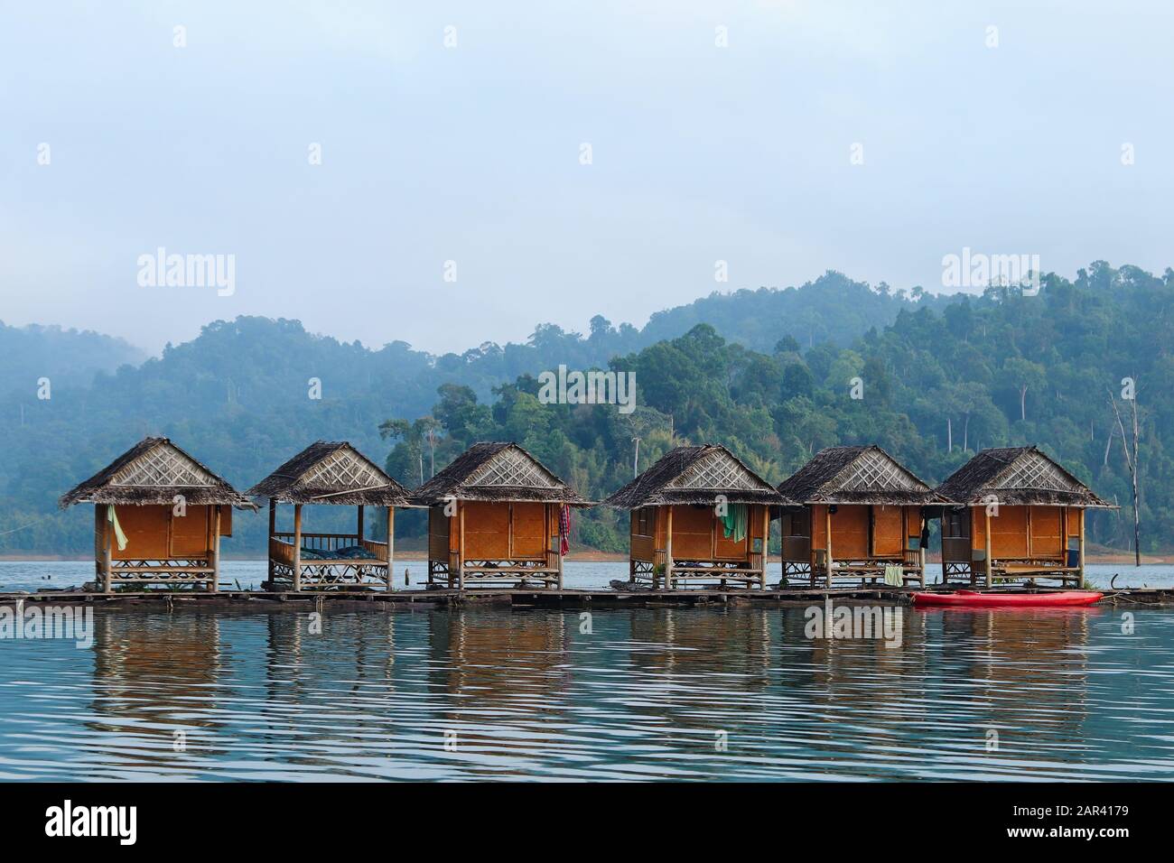 Beautiful view of the wooden huts over the ocean captured in Thailand ...
