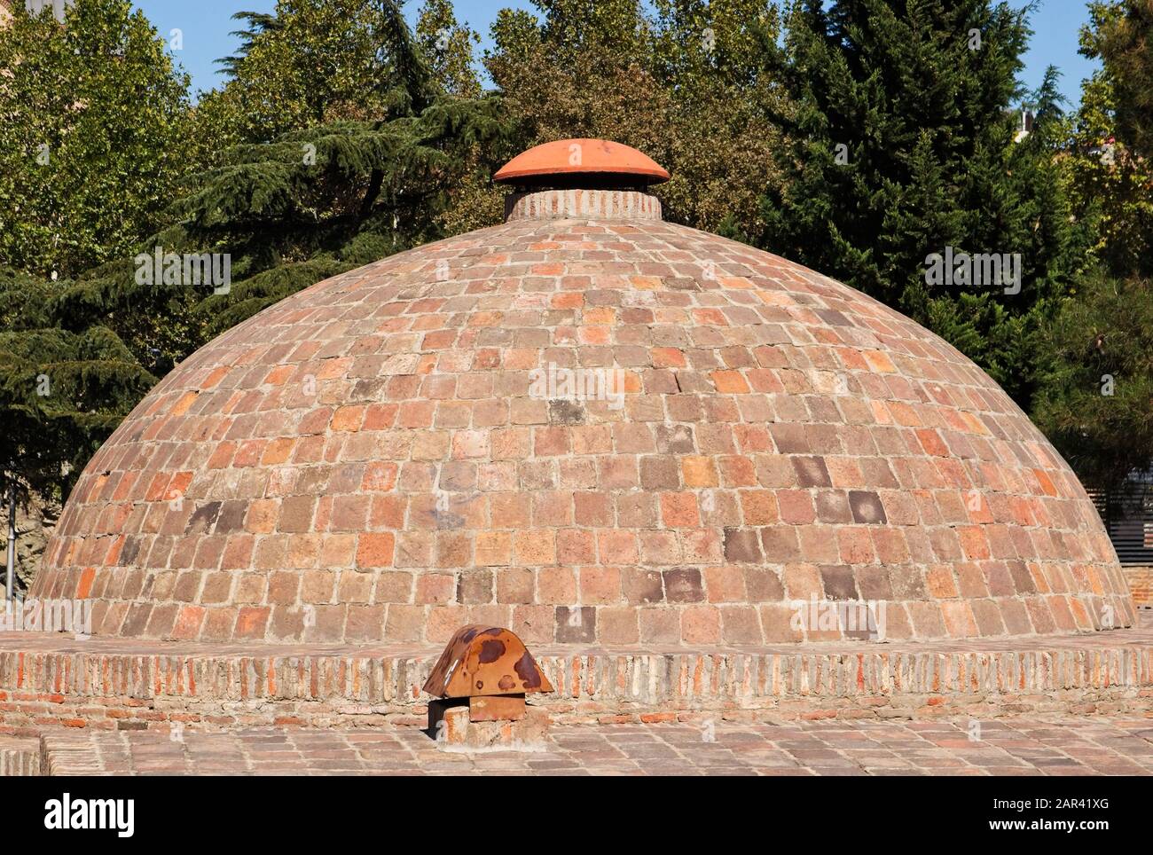 Historic ancient round building surrounded by a forest Stock Photo - Alamy