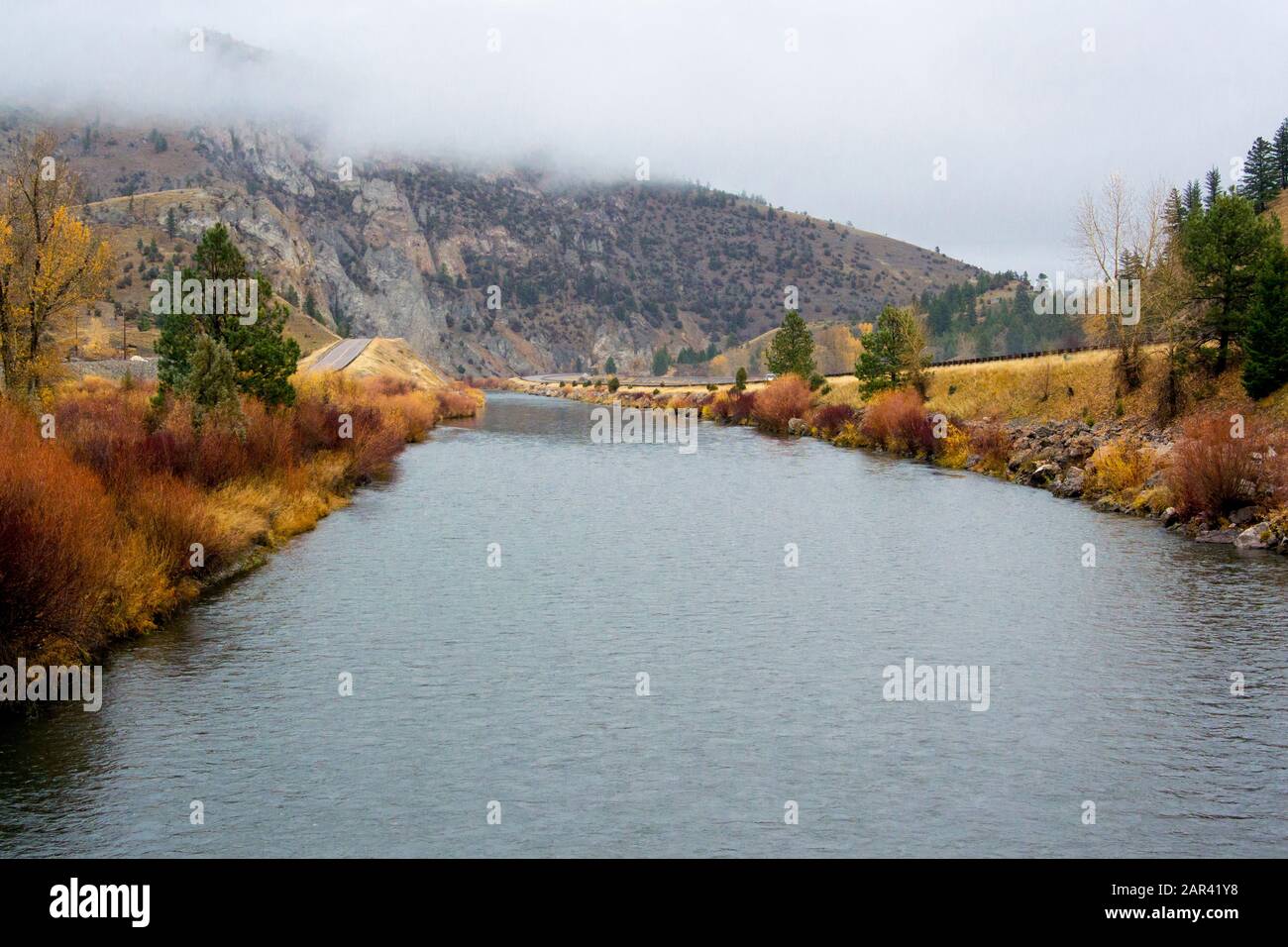 The Clark Fork of the Columbia River in autumn colors, at Bearmouthh ...