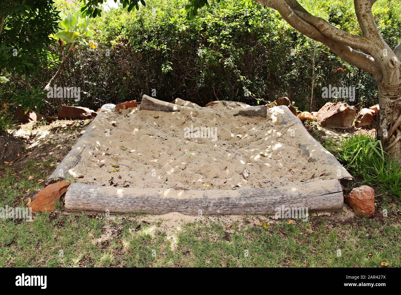 An outdoor sand pit with no children in it Stock Photo - Alamy