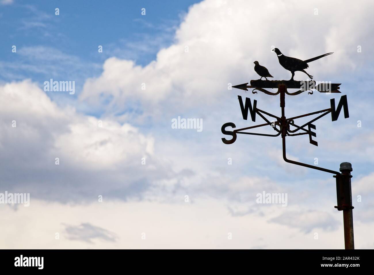 CAPE TOWN, SOUTH AFRICA - Jan 05, 2020: Wind vane isolated on a cloudy ...