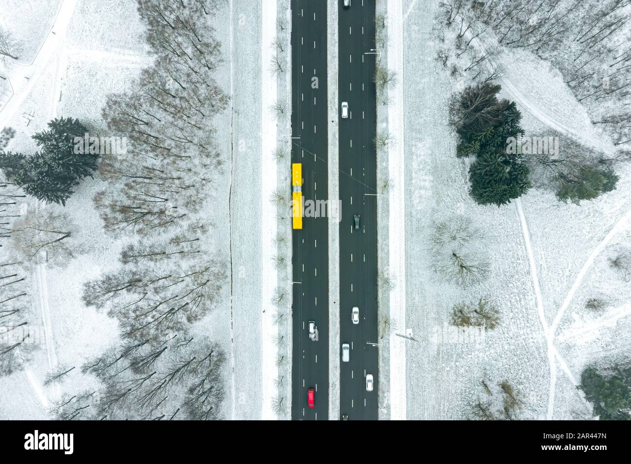 top down image of asphalt road with cars traffic in winter foggy day ...