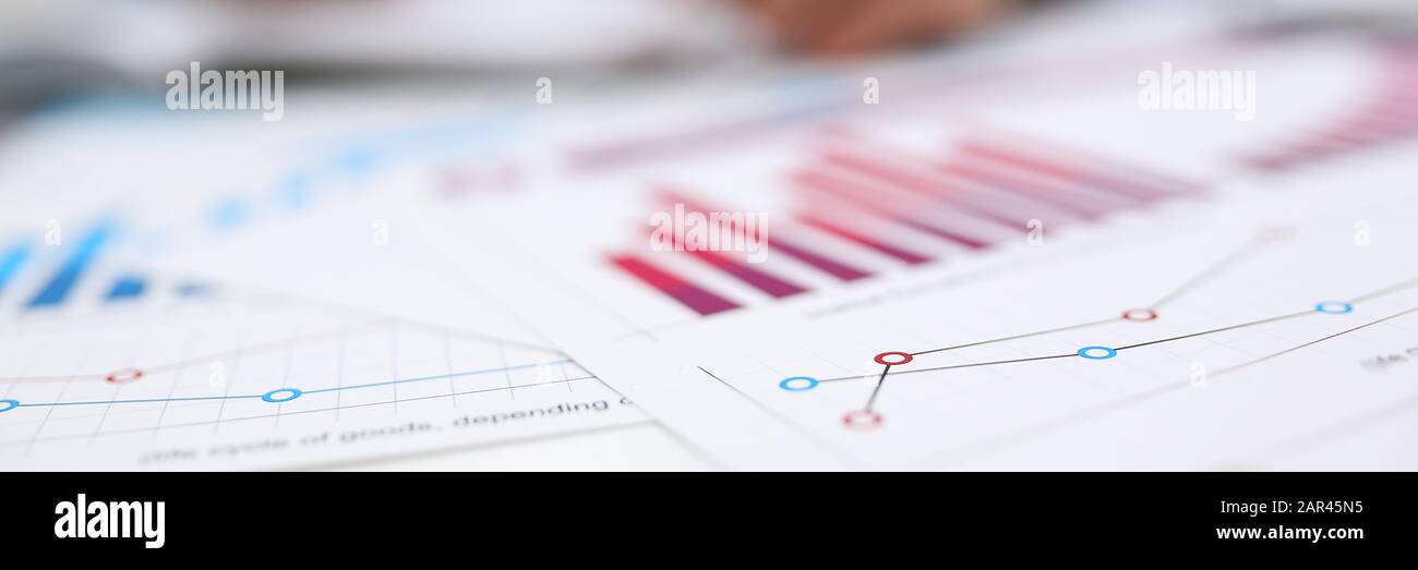 Group of people deliberate on problem with infographics Stock Photo - Alamy
