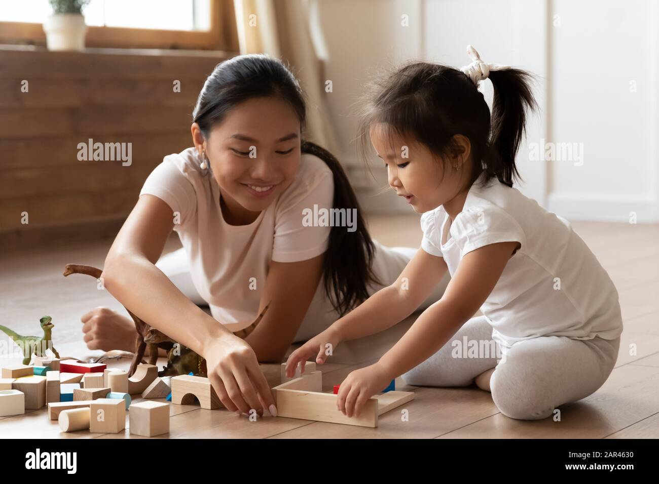 Girl building small bricks hi-res stock photography and images - Alamy
