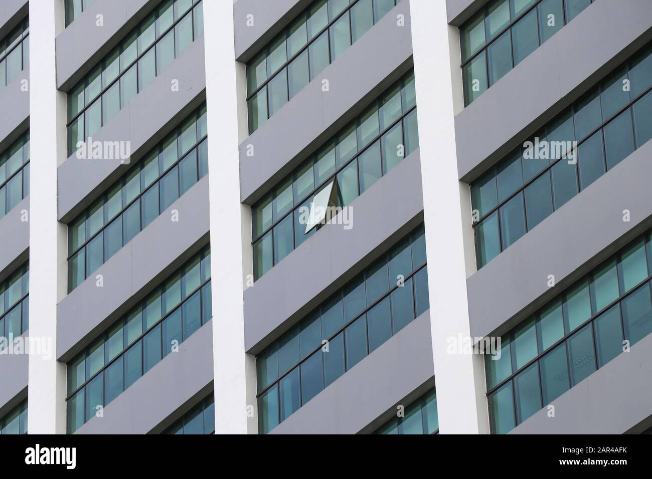 Glass windows of high buildings. Pattern of windows that line the ...