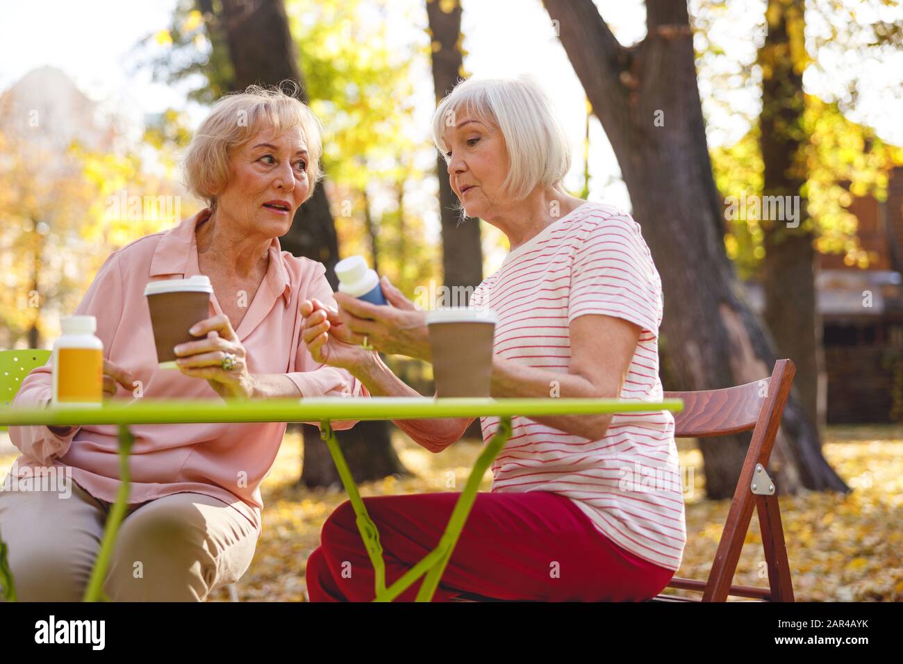 Old friends talking about ways of staying healthy Stock Photo - Alamy