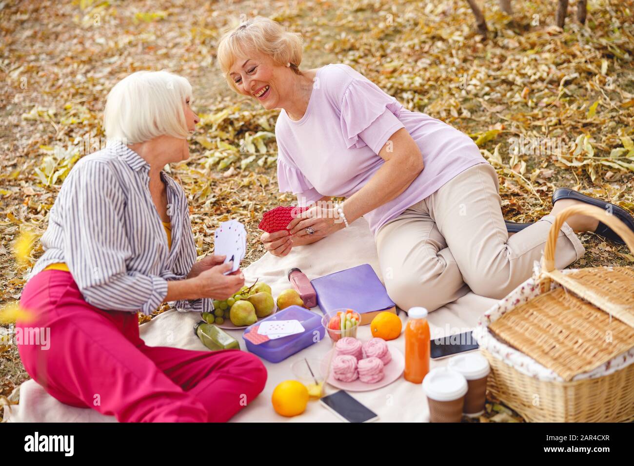Happy old friends laughing and joking together Stock Photo - Alamy