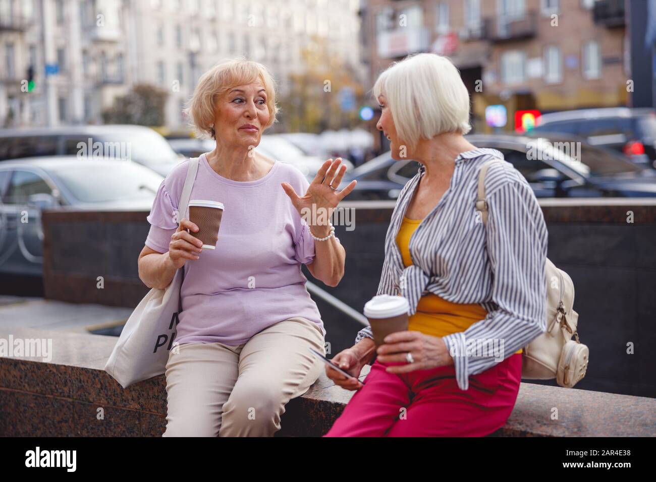 Telling a joke hi-res stock photography and images - Alamy