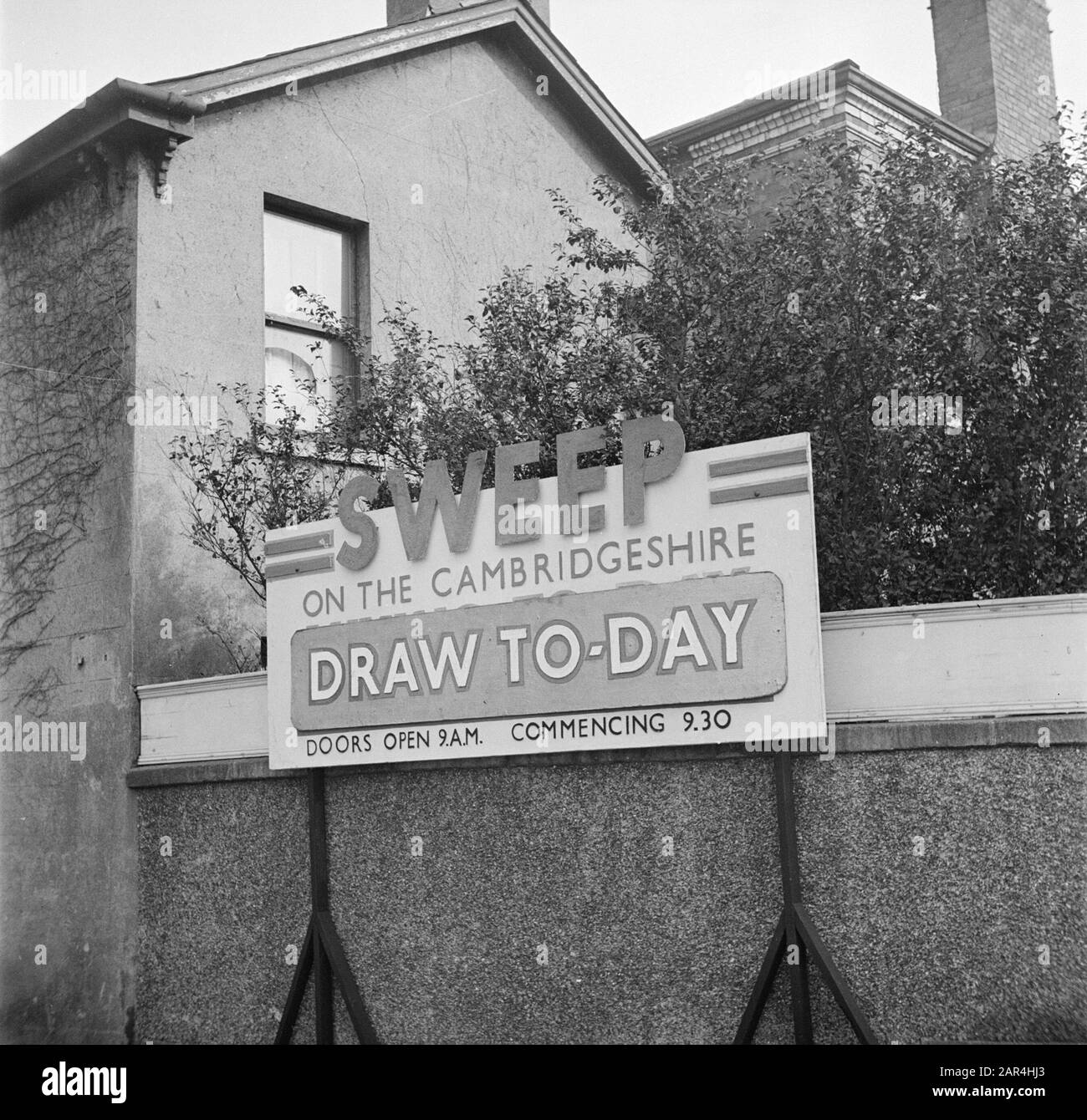 A sign with 'Draw to-day' [draw today] for the Irish Hospitals ...