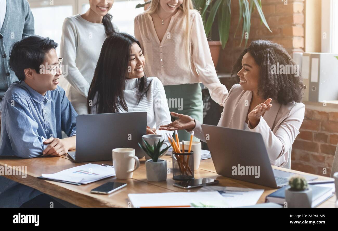 Professional afro woman sharing business ideas with colleagues Stock ...