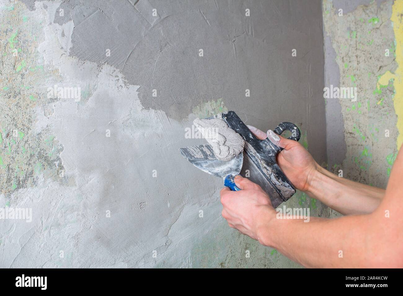 Repair the wall. Plaster the wall with a spatula. Internal construction ...
