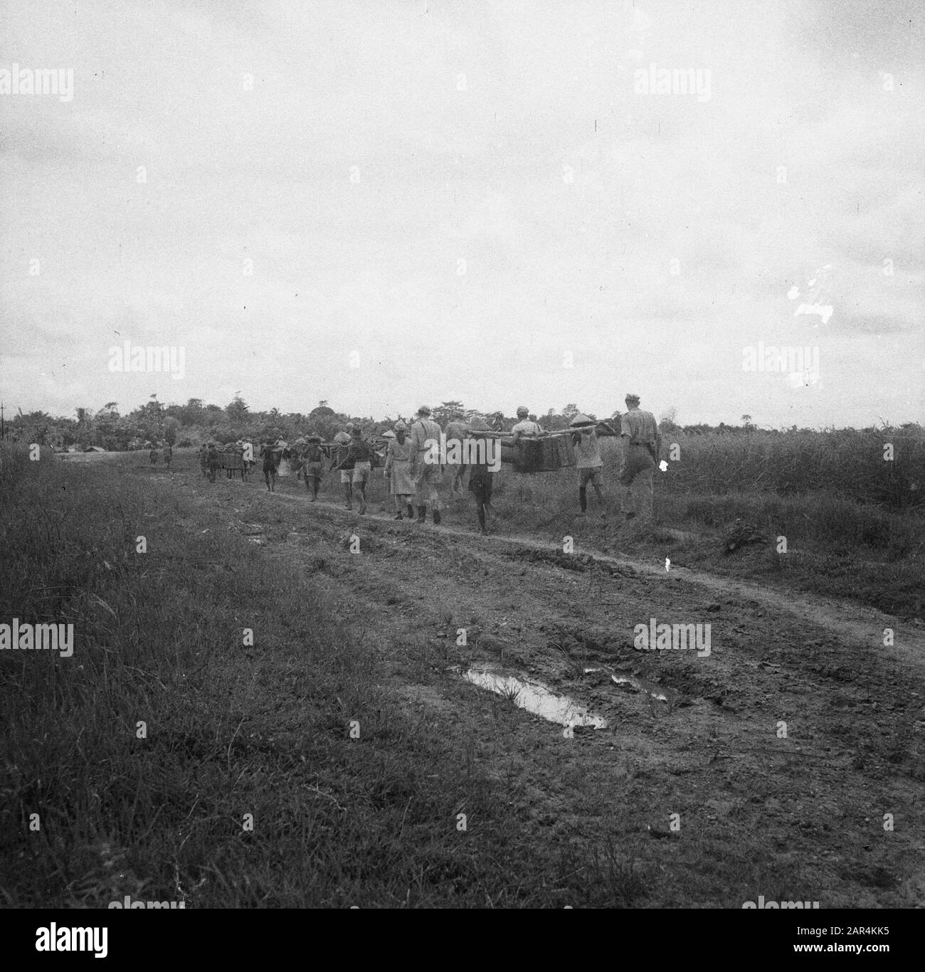 [a caravan with carriers, animals of burden and Red Cross employees on ...