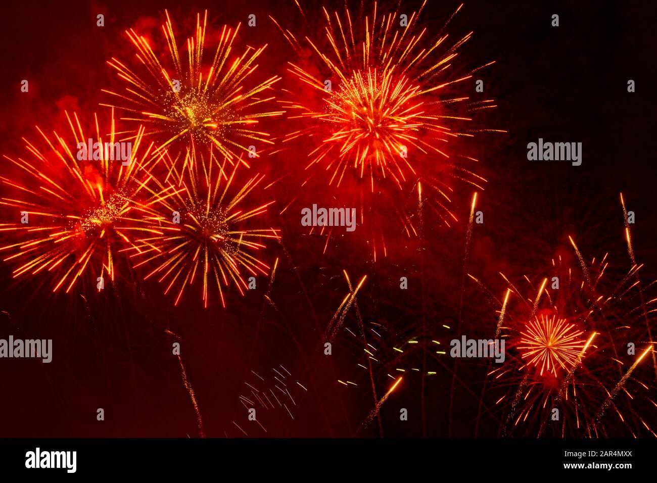 Beautiful orange fireworks display in the urban for celebration on dark ...