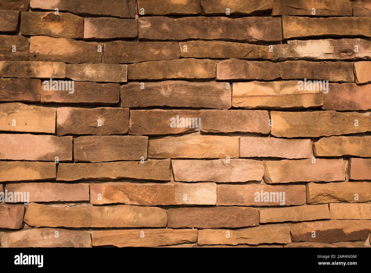 Stone wall texture background natural color Stock Photo - Alamy