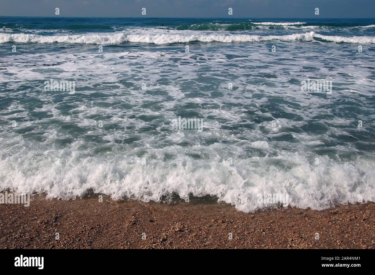 Wave coming onto the shore Stock Photo - Alamy