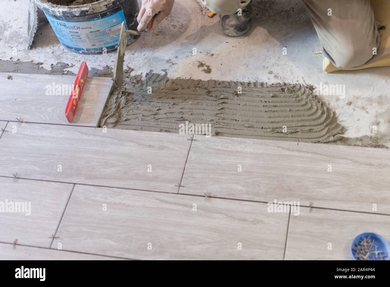How To Install Rectangular Floor Tiles Man Installing Rectangular