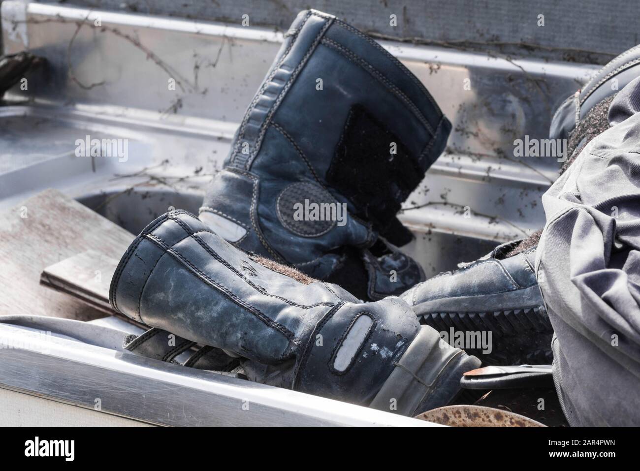 Cowboy boots in mud hi-res stock photography and images - Alamy