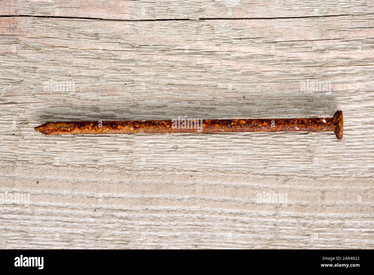 A rusty big and long nail Stock Photo - Alamy