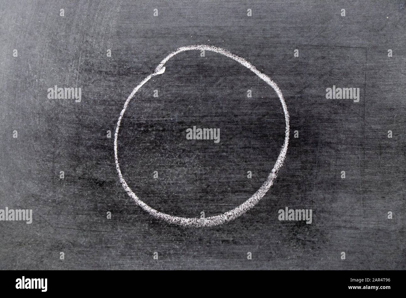 White chalk hand drawing in circle or round shape on black board ...
