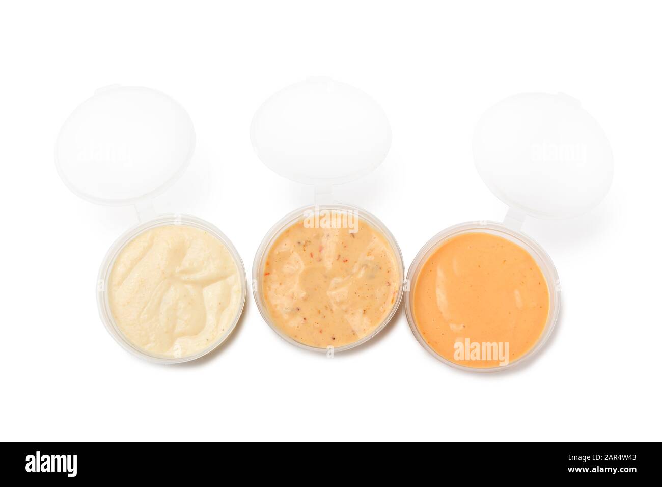 Three dip sauces in a plastic take away container isolated on white ...