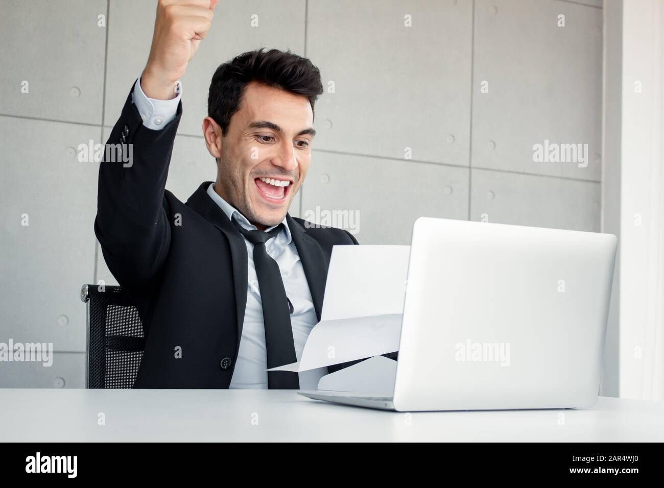 Businessman opened the envelope with symptoms of ecstasy. Male employee ...