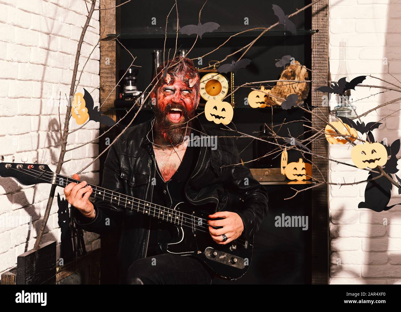 Monster playing electric guitar hi-res stock photography and images - Alamy