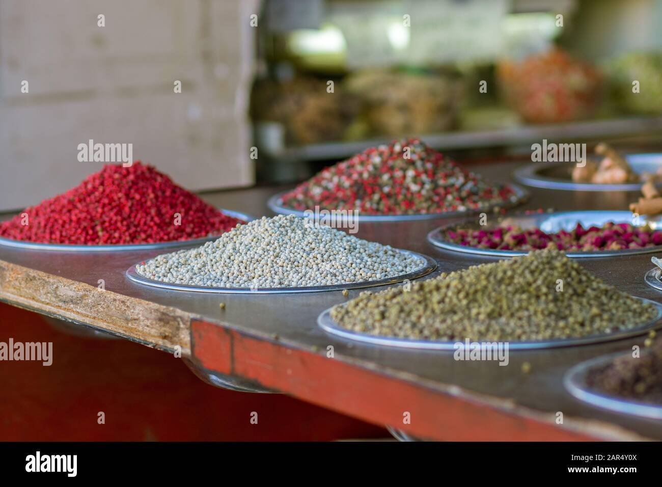 Spices of all kinds and colors, mixed black and white red pepper ...