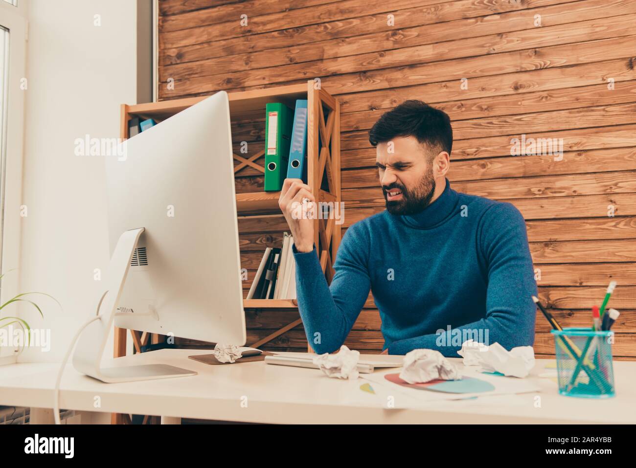 Angry sad man trying to find way to solve difficult task Stock Photo ...
