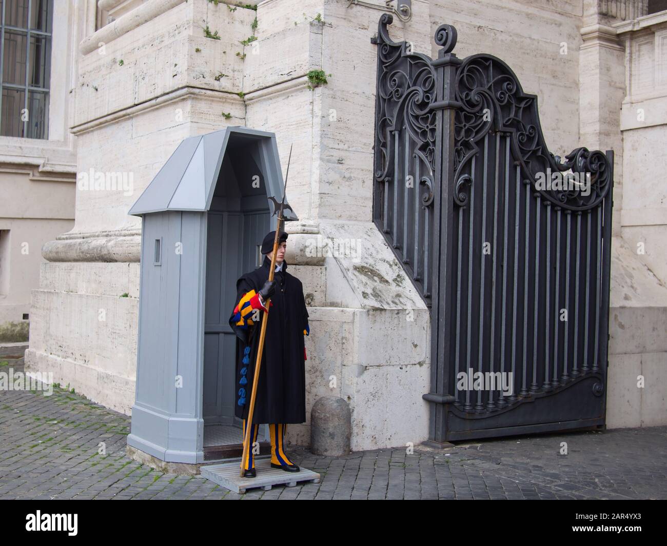 A member of the Pontifical Swiss Guard with halberd in Vatican City ...