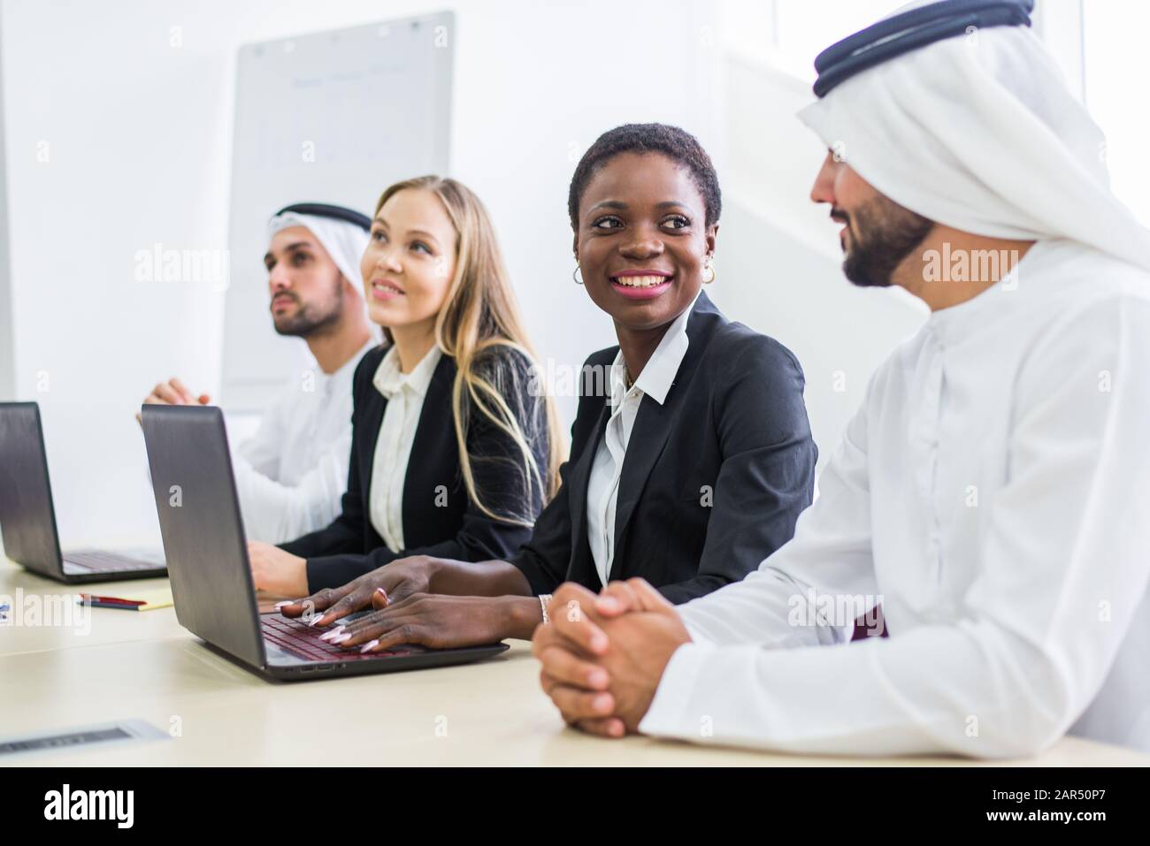 Multiracial group of business people having a meeting in a office ...