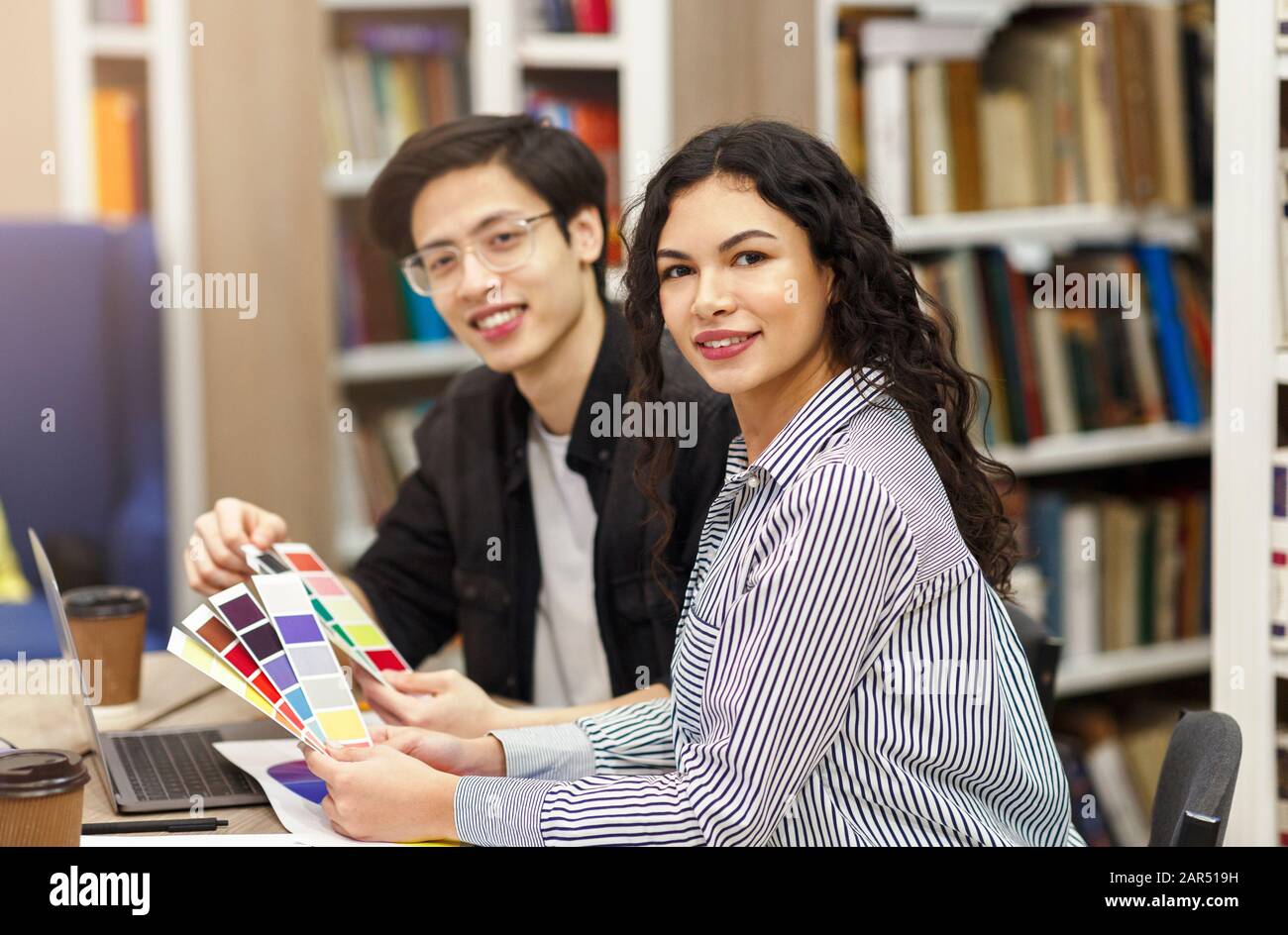 Group of young students holding different colour swatches Stock Photo ...