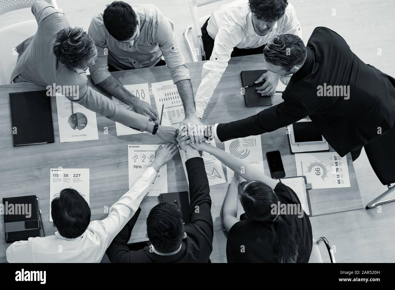 Top view join hands on work table of team of Asian people and ...