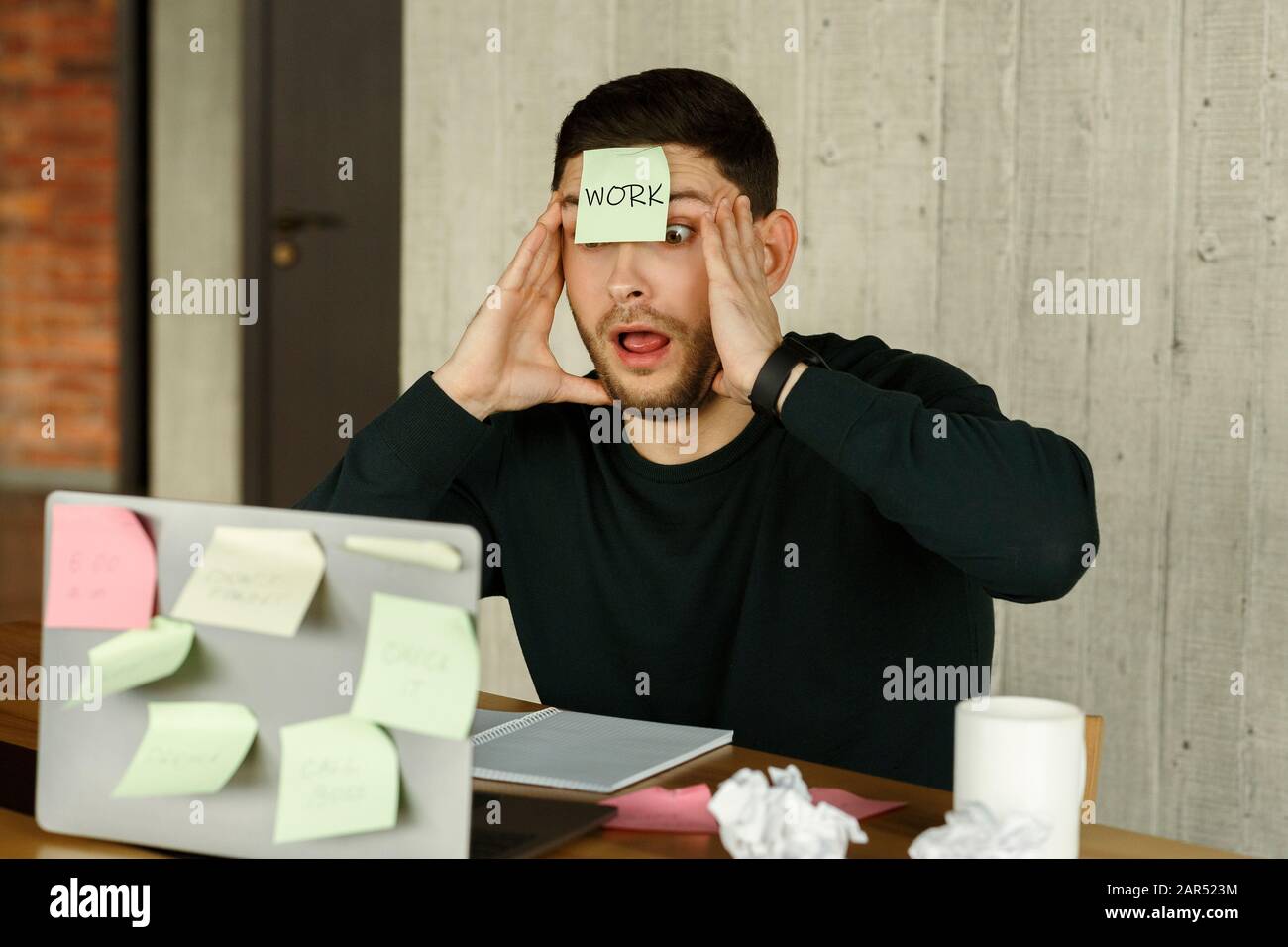 Man Having Sticky Notes Everywhere Sitting At Laptop In Office Stock ...